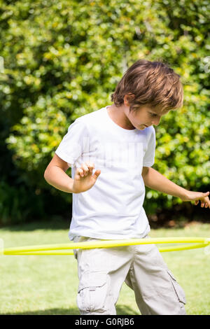 Child playing with a hoop; The hoop Stock Photo - Alamy