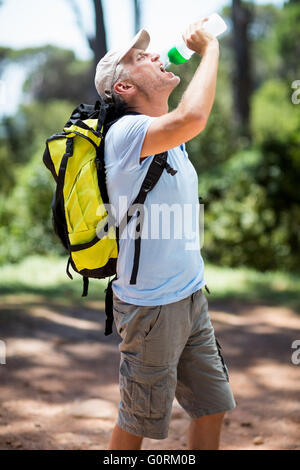 man drinking with a flask Stock Photo - Alamy