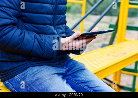 Closeup of network engineer using tablet while setting up servers, copy ...