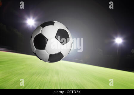 soccer ball flying into football goal net over sky Stock Photo - Alamy