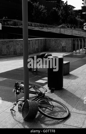man sleeping on bike Stock Photo - Alamy