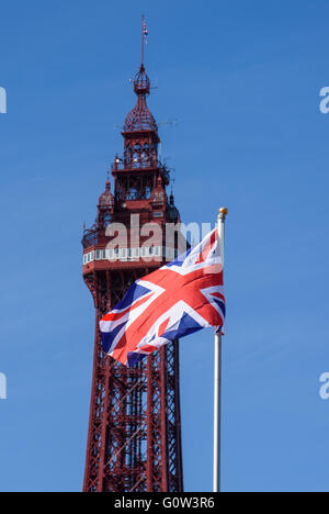 Union Jack flag fluttering in the wind with a blue sky and cloud ...