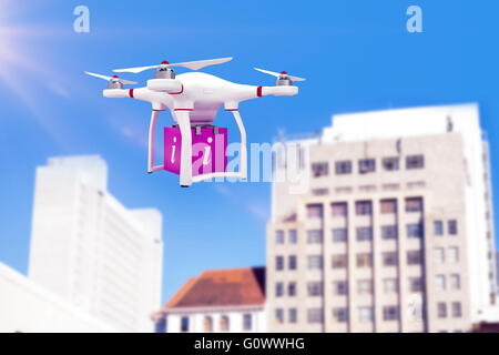 Composite image of a drone bringing a pink cube Stock Photo - Alamy
