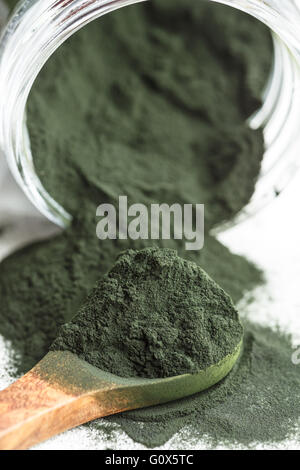Spoon with spirulina powder on white background Stock Photo - Alamy