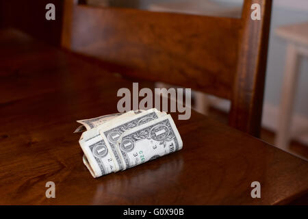 A Green paper note with phrase Money is the currency of possibility on ...