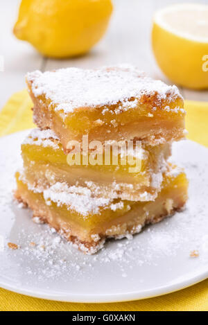 Plate with delicious lemon pie bars on cooling rack Stock Photo - Alamy