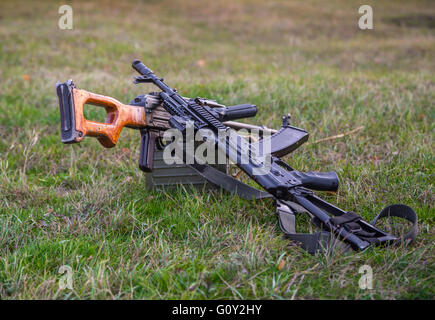 two machine guns lying in the grass Stock Photo - Alamy