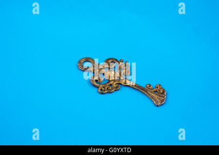 Retro styled key in water in blue background Stock Photo - Alamy
