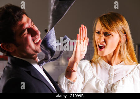 Male and female business people slapping eachother high five Full body ...