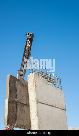 Crane removing a large formwork panel as used for concrete shuttering ...