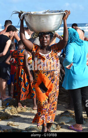 African woman carrying a bowl of fish on her head in Ivory Coast Stock ...