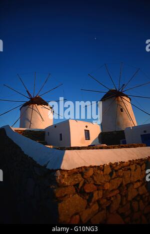 Traditional windmills (Kato Milli) at sunset in Mykonos town, Greece ...