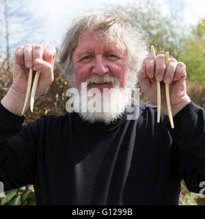 Man playing the musical bones, an Old folk instrument Stock Photo - Alamy