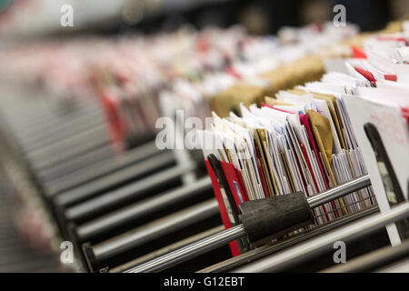 A postman at a Royal Mail sorting office Deptford, south London. UK ...