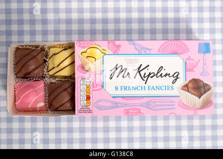A box of Mr Kipling French Fancies shot on a pink background Stock ...