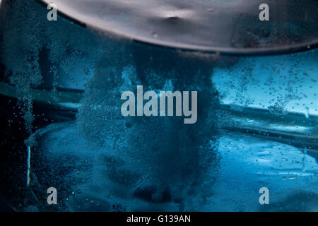 Erlenmeyer flask close up with chemical reaction fizzing Stock Photo ...