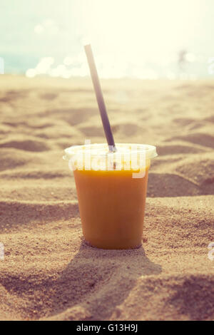 Smoothies with tropical fruits on a blue wooden background. Tasty ...