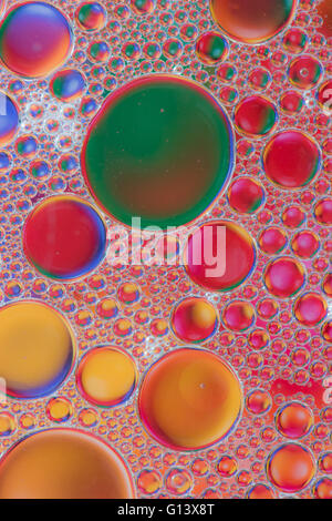 oil bubbles on water and colored background Stock Photo - Alamy