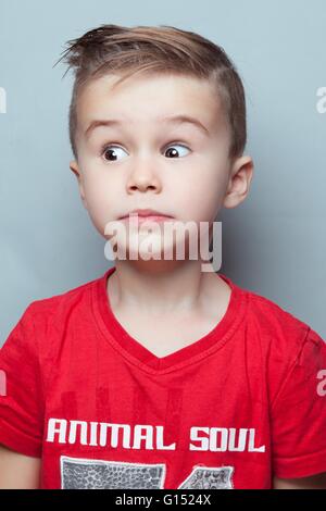 Side view studio portrait of boy, teenager in motion, running isolated ...