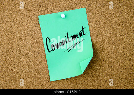 Commitment written on green paper note Stock Photo - Alamy