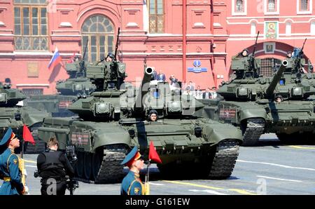 Russian soldiers in T-14 Armata battle tanks march along the Red Square ...