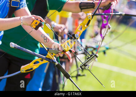A man is shooting with a recurve bow during un open archery competition ...