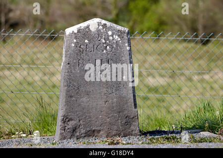 old irish milestone marker by the side of new road Enniscrone county ...