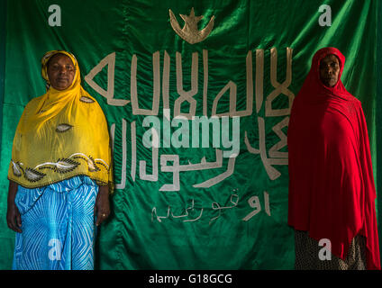 Sufi worshippers in front of islamic flags, Harari region, Harar ...