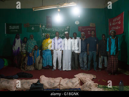 Sufi men worshippers in front of islamic flag, Harari region, Harar ...
