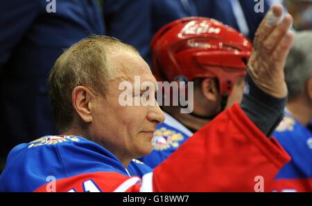 Russian President Vladimir Putin waves after his annual news conference ...