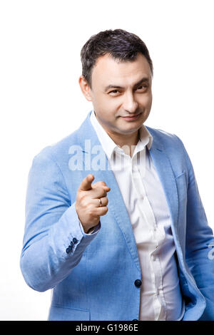 Middle aged business man points his finger at you Stock Photo - Alamy