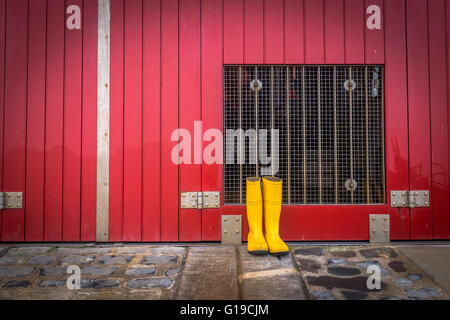 Yellow wellington boots outside the RNLI lifeboat station at Stock ...