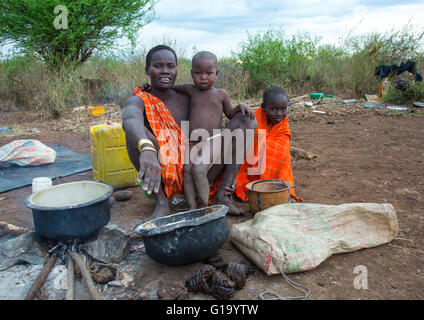 Three Mursi women of the Omo Valley in Ethiopia with lip plates, bone ...