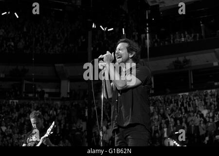 Eddie Vedder, lead singer of Pearl Jam standing a the microphone ...