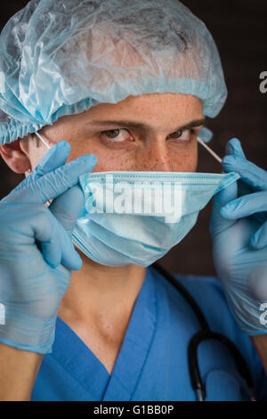 Young doctor with first aid kit in hospital Stock Photo - Alamy