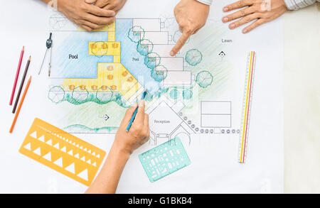 Landscape architect changing drawing at meeting with client Stock Photo ...
