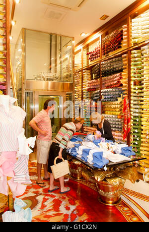 saleswoman showing material to customers, shop, india Stock Photo - Alamy