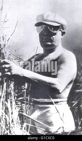 Benito Mussolini the Italian fascist leader in an open top car with his ...