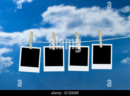 Washing Line with hanging blank Polariod paper Stock Photo - Alamy