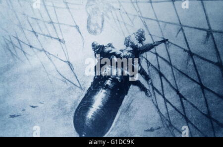 WORLD WAR II: TORPEDO NET. /nA U.S. Navy ship laying an anti-torpedo ...