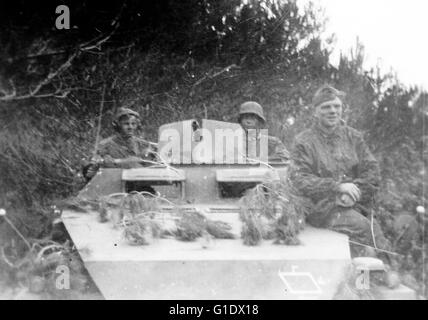 Waffen SS men in camouflage jackets with wounded in Greece 1944 Stock ...