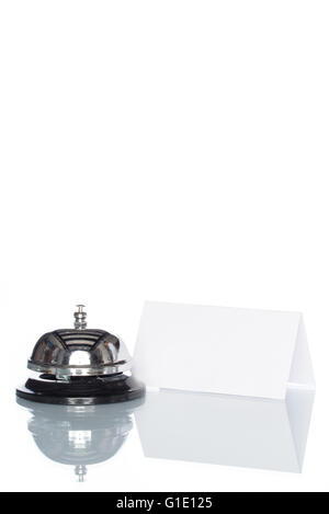 Service bell on the Check in desk with white background Stock Photo - Alamy