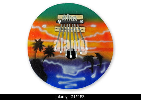 Thumb piano, karimbu, kalimba spiritual instruments in coconut isolated on white background ...