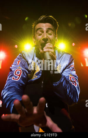 Lead singer Jacob Hoggard of Hedley performs on an outdoor stage before ...