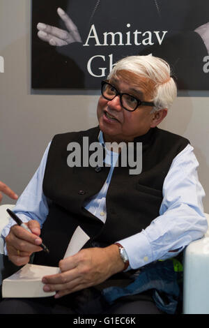 Torino, Italy. 13th May 2016. Indian writer Amitav Ghosh signs an ...