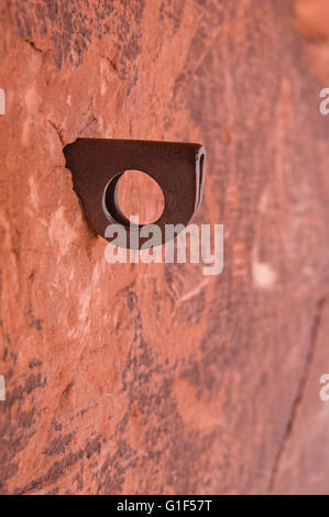 Old rusty anchor on rock by blue sea Stock Photo - Alamy