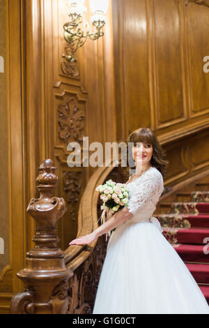 Women hand holding a bouquet of Classic Sensation roses variety, studio ...