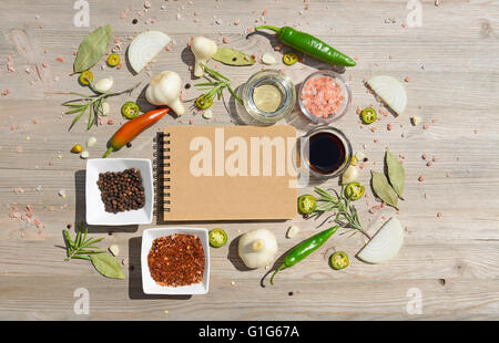 Food background. Blank notebook for notes and pepper, bay leaf ...