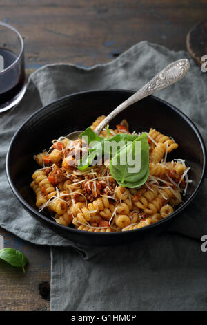 Italian pasta with tomato, meat. Close-up spaghetti Bolognese wind it ...