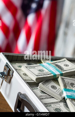 Dollar bundles and brown case Stock Photo - Alamy